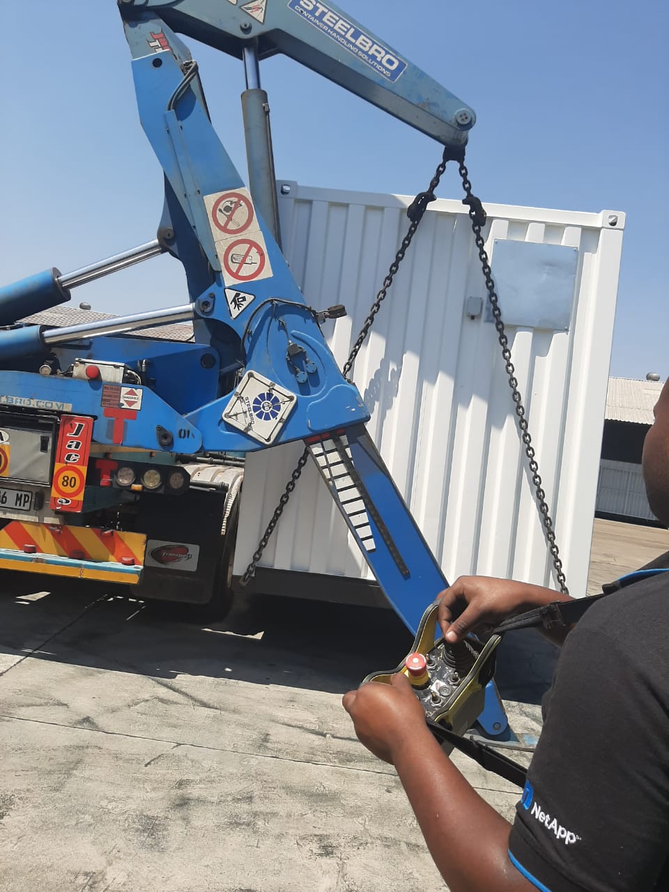 Radio remote controlled container side-lifter.